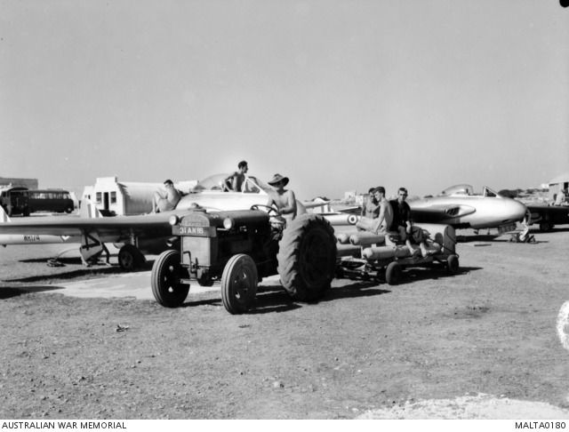 Maintenance personnel of 78 Fighter Wing RAAF servicing Vampire jet ...