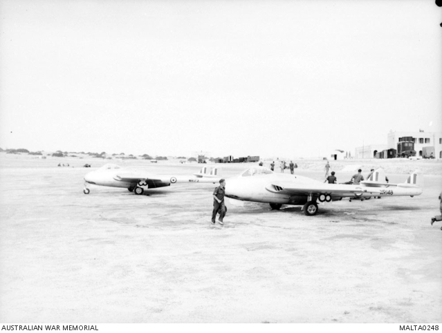 Ground staff of 78 Fighter Wing RAAF rushing away from Vampire aircraft ...