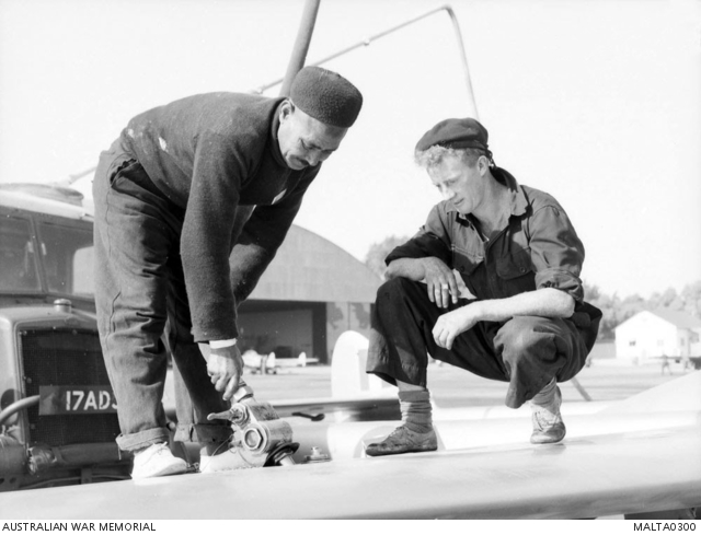 Idris. Leading Aircraftman Jim Bushell of Ballina, NSW, looks on as a ...
