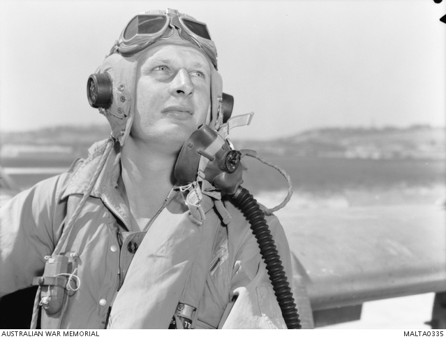 Portrait of Pilot Officer Athol Fraser of WA in his flying suit. PO ...
