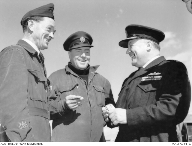 Two ground staff members of 78 Fighter Wing RAAF chat with Group ...
