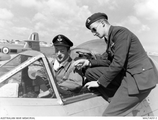 Pilot Officer Keith Meggs of Preston, Vic sits in the cockpit of a ...