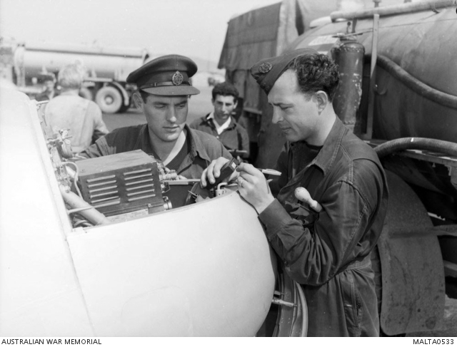 Corporal Gordon Linklater changes a magazine in one of the camera guns ...