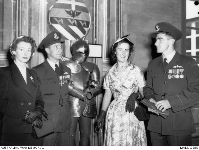 Two RAAF pilots and their wives pictured after a special investiture at ...