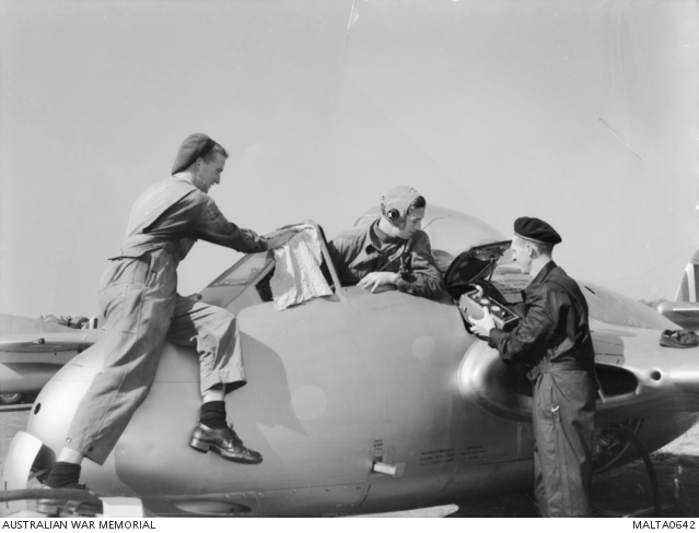 Ground staff of 78 Fighter Wing RAAF at work maintaining a Vampire ...