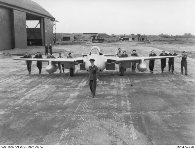 Unidentified ground staff of 78 Fighter Wing RAAF wheel one of the Wing ...