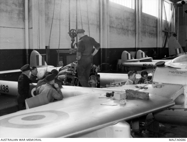 Unidentified maintenance staff of 78 Fighter Wing RAAF install a new ...