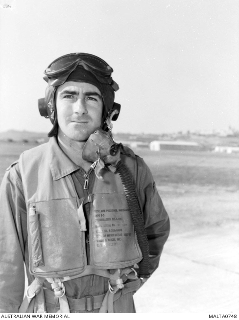 Portrait of Flying Officer John Myers of Randwick, NSW, wearing his flying suit. He is stationed ...