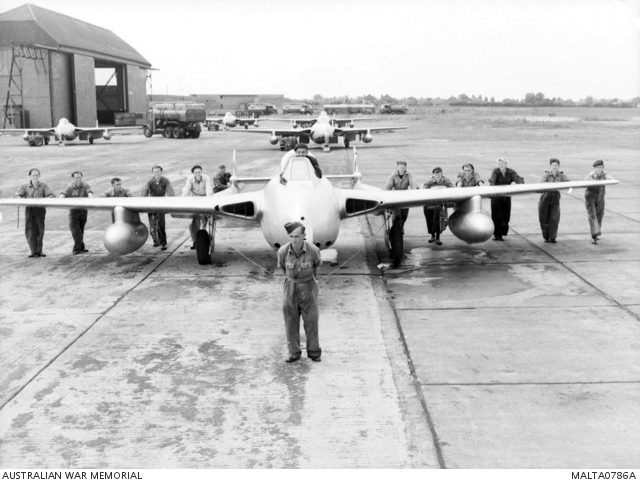 Members of 78 Fighter Wing RAAF ground staff pulling out one of the ...