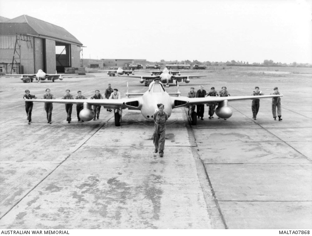 Members of 78 Fighter Wing RAAF ground staff pulling out one of the ...