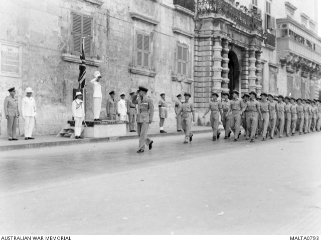 The Governor of Malta, Sir Gerald Hallen Creasy, takes the salute from ...