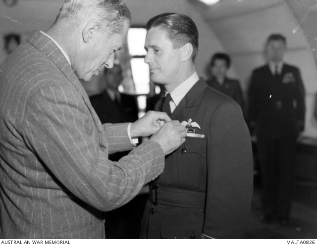 The Governor of Malta, Sir Gerald Creasy, pins a Distinguished Flying ...