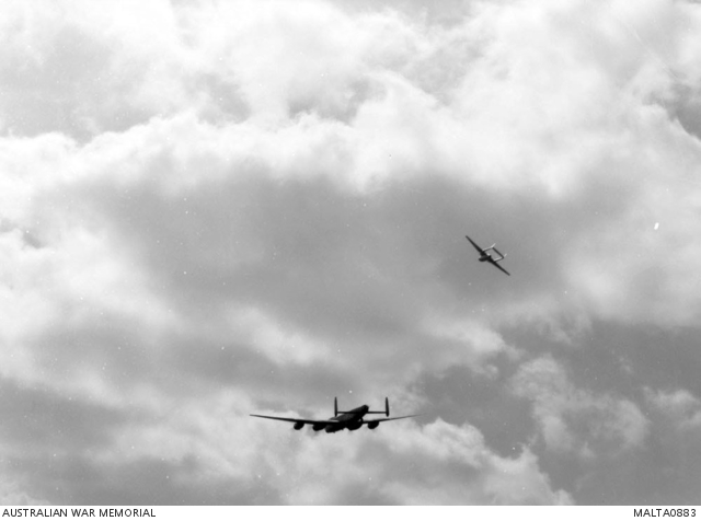 An RAAF Vampire fighter aircraft breaks off its attack on a low flying ...
