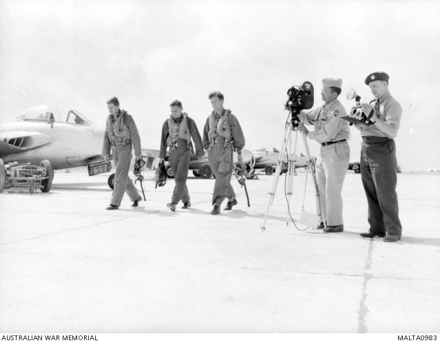 Photographers from the United Nations train their cameras on three ...