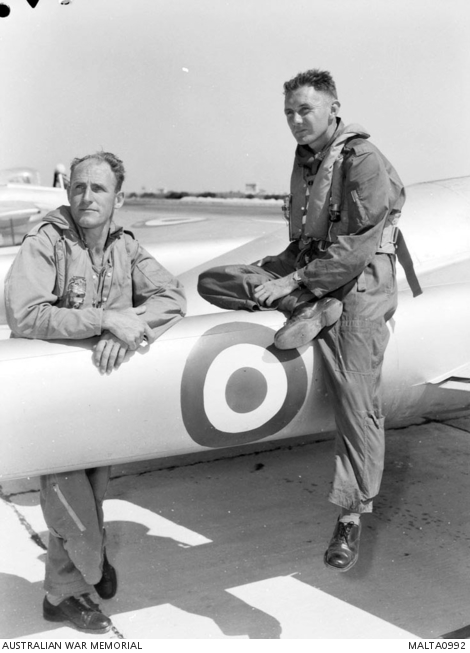 Two pilots of 78 Fighter Wing RAAF relax while waiting for the signal ...