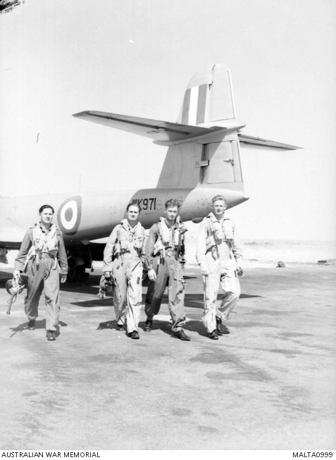 Four pilots from 78 Fighter Wing RAAF leave the tarmac after a gunnery ...
