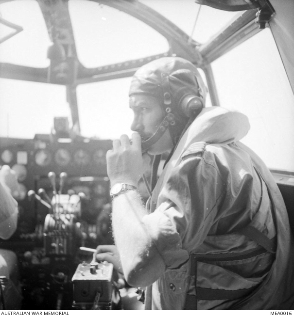 Western Desert. c. 1942. Sitting in the cockpit of his Lockheed Hudson ...