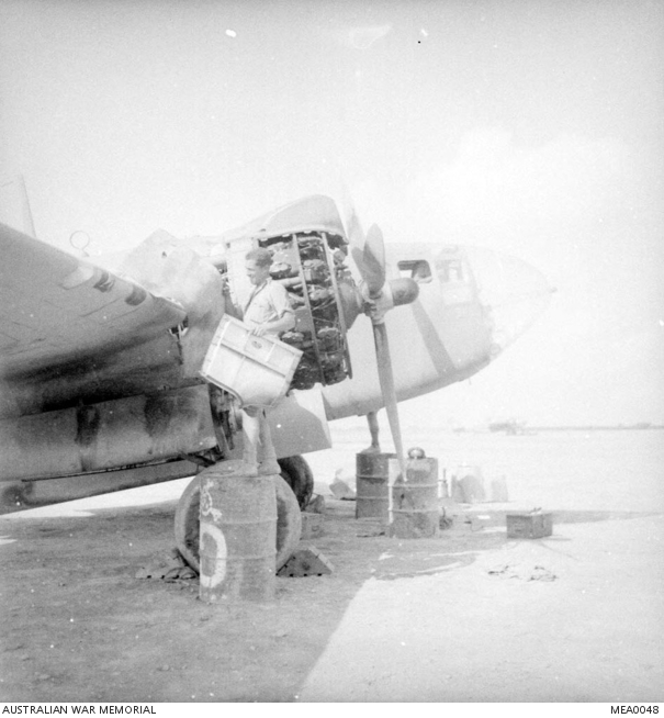 Western Desert. c. 1942. Fitter mechanic working on a Martin Baltimore ...
