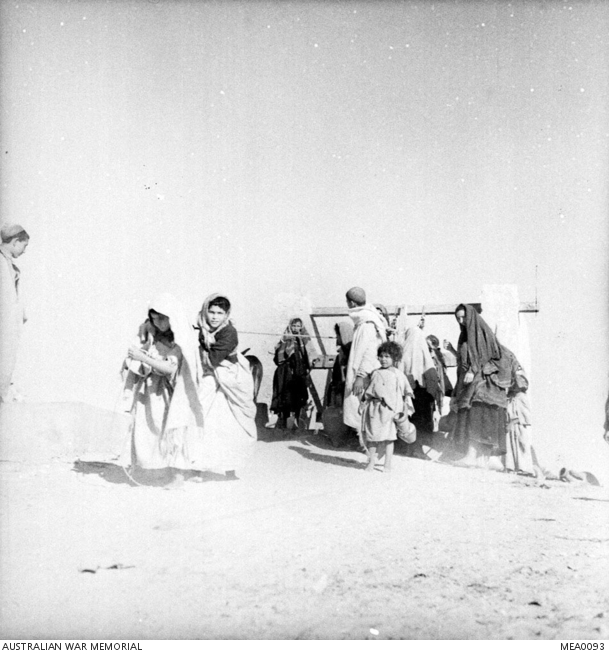 Sousse, Tunisia. A small group of local men, women and children watch ...