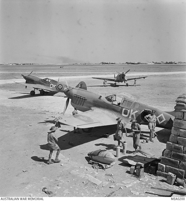 Malta. July 1943. RAAF ground crew take over to check this Kittyhawk ...