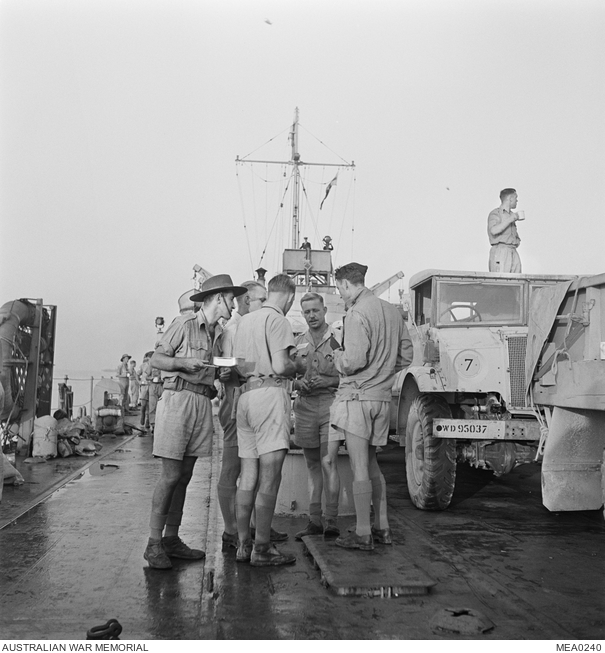 Members of No. 450 (Kittyhawk) Squadron RAAF on board a transport ship ...