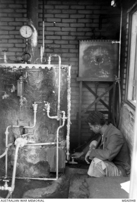 Heliopolis, Egypt. An Egyptian native at work in the shop of the ...