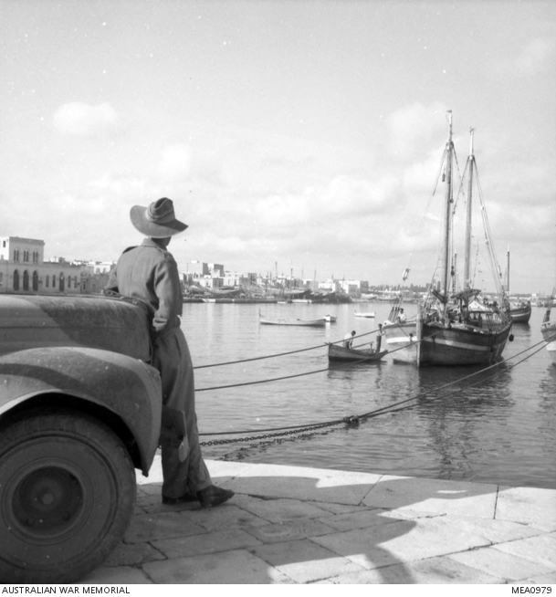 Isle of Capri, Italy. c. 1943. A RAAF airman stands at the edge of the ...
