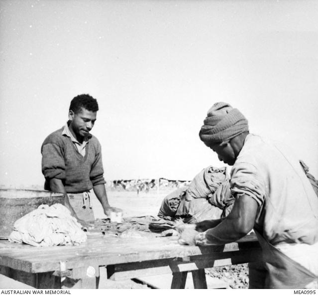 Western Desert, North Africa. c. 1943. Two Egyptian natives washing ...