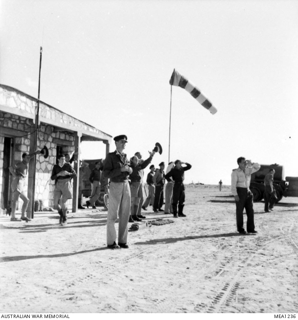 El Daba, Egypt. c. 1943. An aircraft seems to be in trouble up in the ...