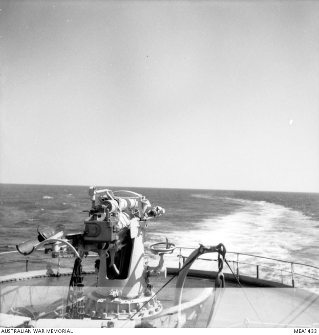 At Sea. March 1944. A long white trail of foam marks the progress of ...