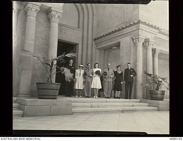 Cairo, Egypt. 15 April 1944. The bridal party on the steps of All Saints Cathedral after the ...