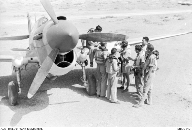 Kairouan, Tunisia. c. May 1943. Pilots of No. 450 Squadron RAAF discuss ...