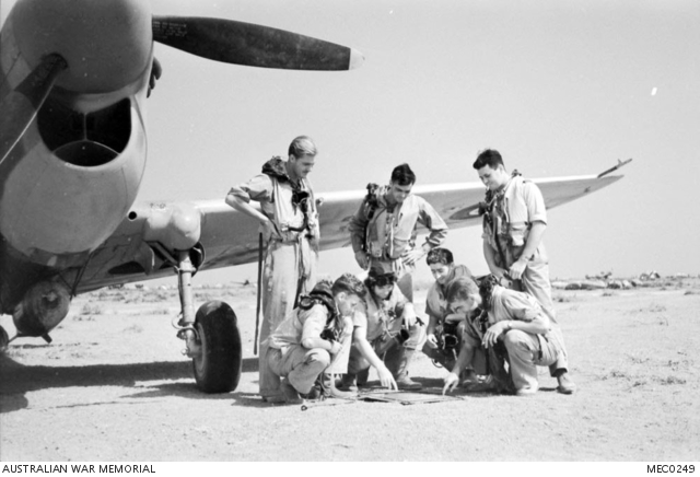 Kairouan, Tunisia. c. May 1943. Pilots of No. 450 Squadron RAAF discuss ...