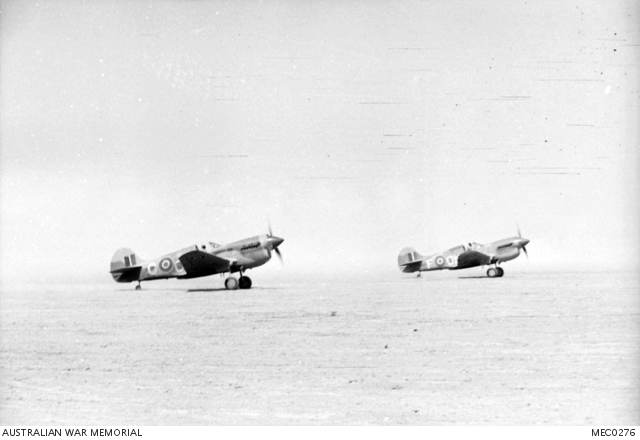 Kairouan, Tunisia. c. 18 April 1943. Two Curtiss P40 Kittyhawk fighter ...