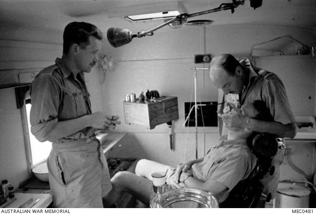 Tunisia. 1943. A dentist at work on a patient in the Mobile Dental Unit ...