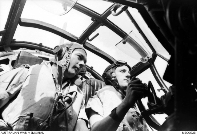 Protville, Tunisia. c. June 1943. The pilot (right) and a crew member of No. 458 Squadron RAAF ...