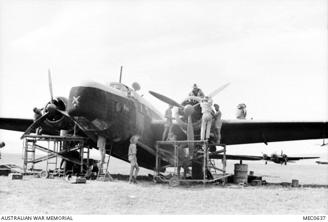 Protville, Tunisia. c. June 1943. Fitters of No. 458 Squadron RAAF work ...