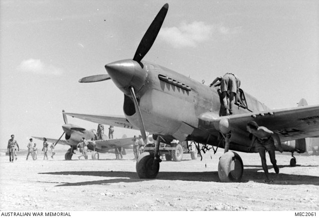 Malta. c. July 1943. The ground crew of No. 3 Squadron RAAF, giving ...