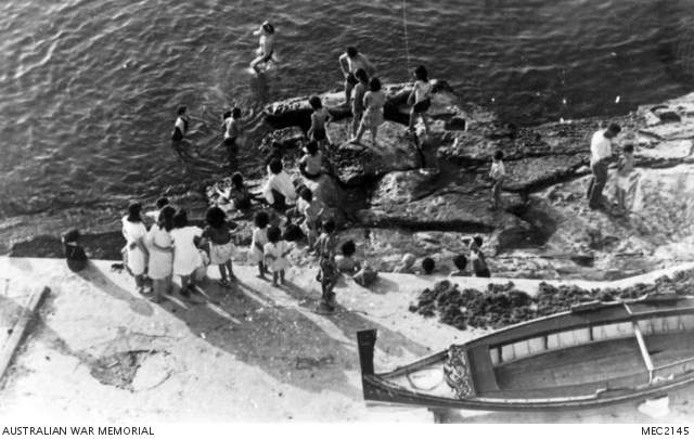 Malta. c. July 1943. A small group of Maltese children gather on the ...