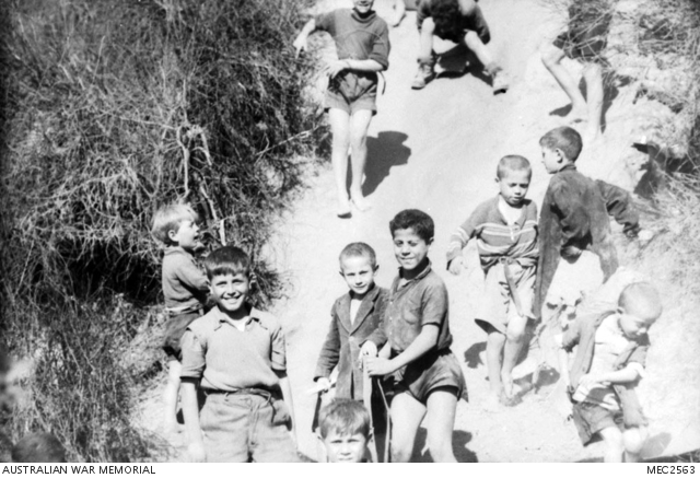Naples, Italy. c. 1943. Children playing in the sand on a hillside in ...