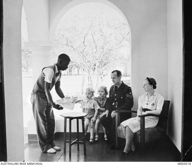 Rhodesia. c. 1942. A RAF Flight Sergeant with his wife and family are ...