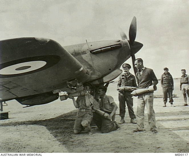 Straight from the battle front is the bomb-carrying Hawker Hurricane ...