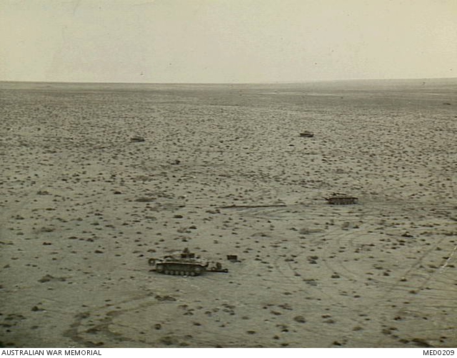 Stricken tanks, scattered across the desert, immobilised by air attack ...