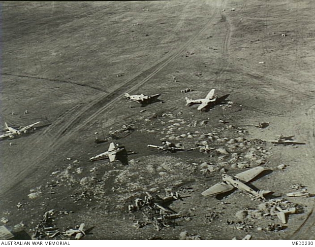 A litter of smashed Axis troop carriers and other aircraft on Derna ...