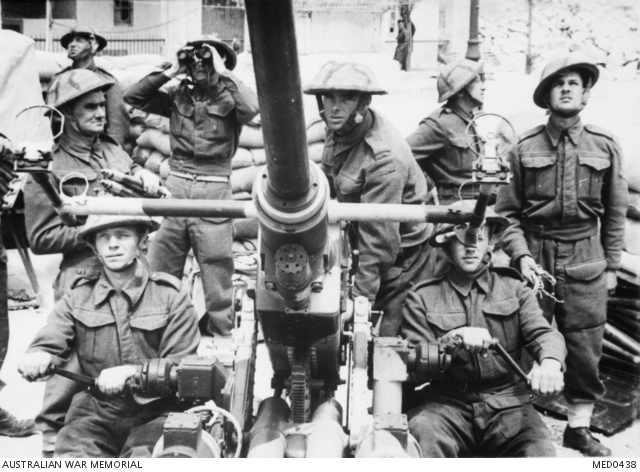Members of a Malta ack-ack (anti-aircraft) crew man their gun ready to ...