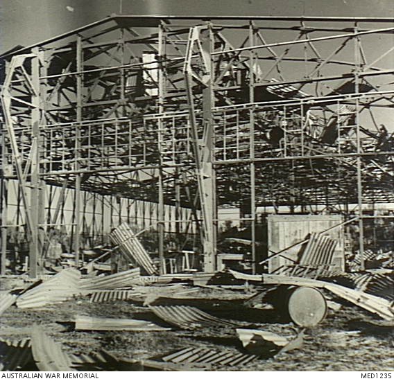 Tripolitania, Libya. 31 January 1943. A wrecked hangar on the airfield ...