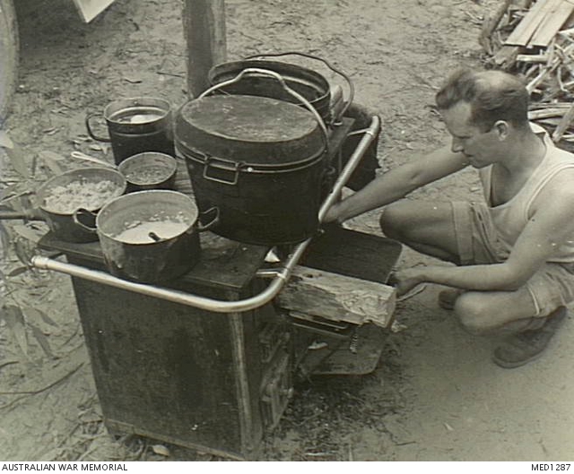 Tripolitania, Libya. 17 February 1943. Bert, the unit cook, sees how ...