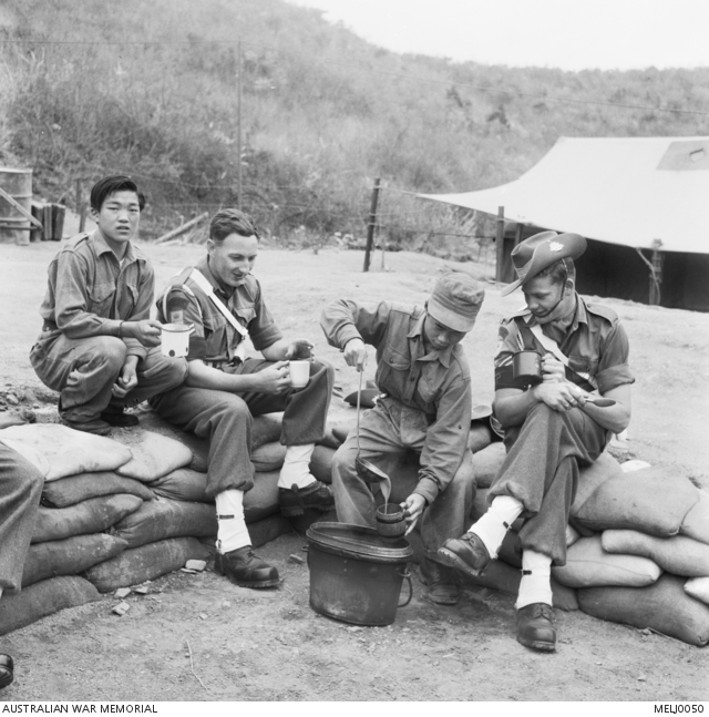 Enjoying a tea break at a camp in Korea are, left to right: Kim-San ...