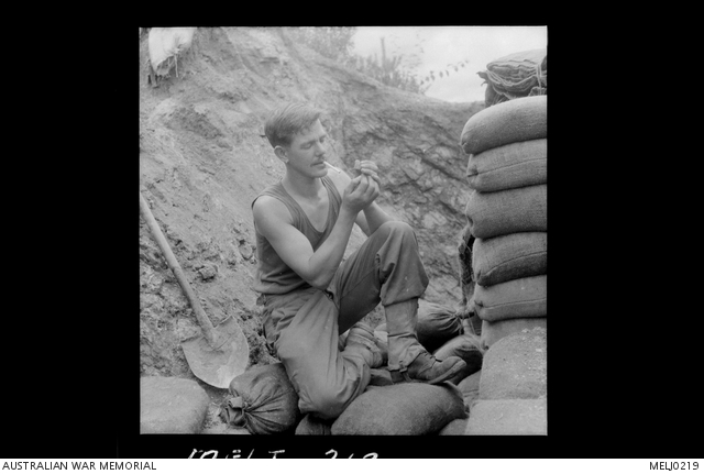 34418 Private (Pte) Bruce Desmond Johansen of Stawell, Vic, is filling ...
