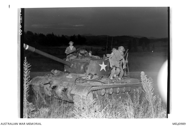 Night exercise in Korea. An American Patton tank, part of an armoured ...